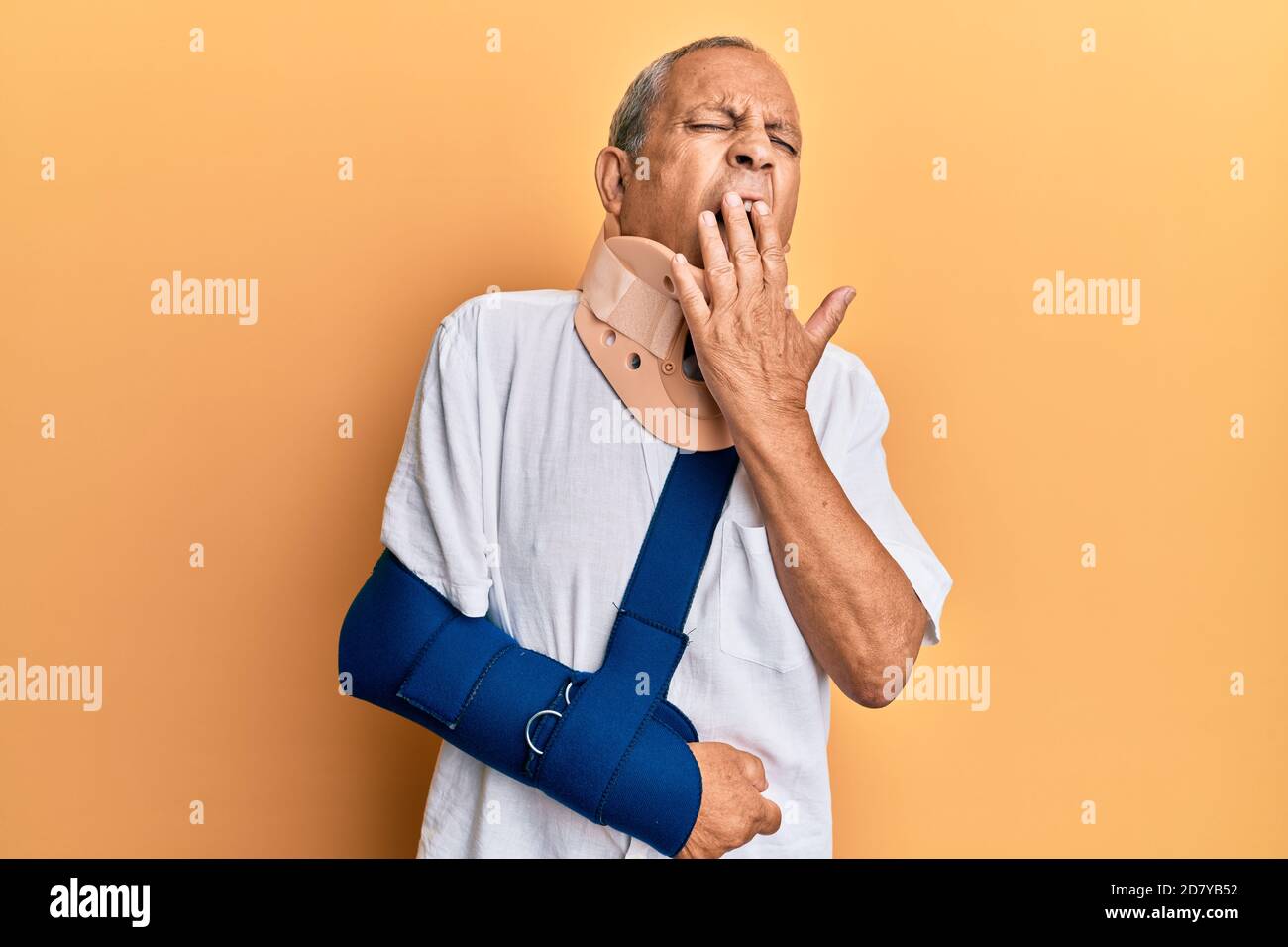 Handsome mature senior man wearing cervical collar and arm on sling ...