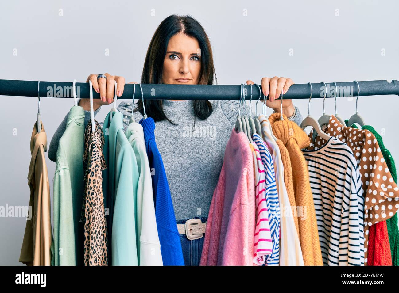 Middle age brunette woman working as professional personal shopper ...