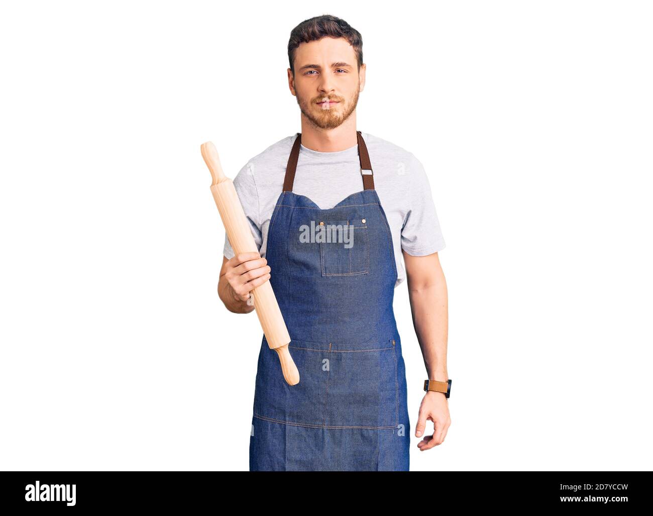 Handsome young man with bear wearing professional baker apron holding ...