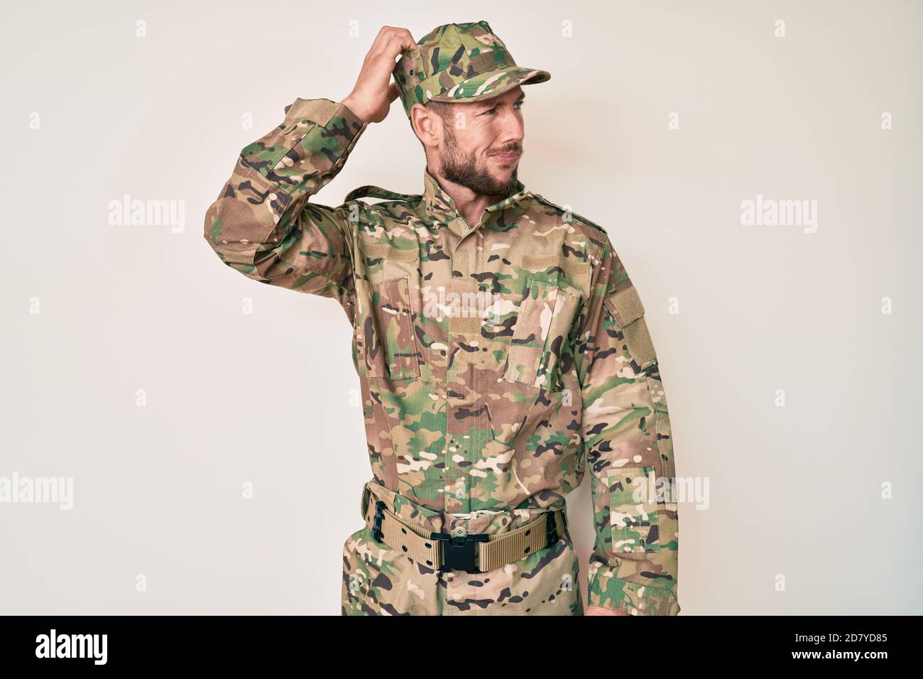 Young caucasian man wearing camouflage army uniform confuse and ...