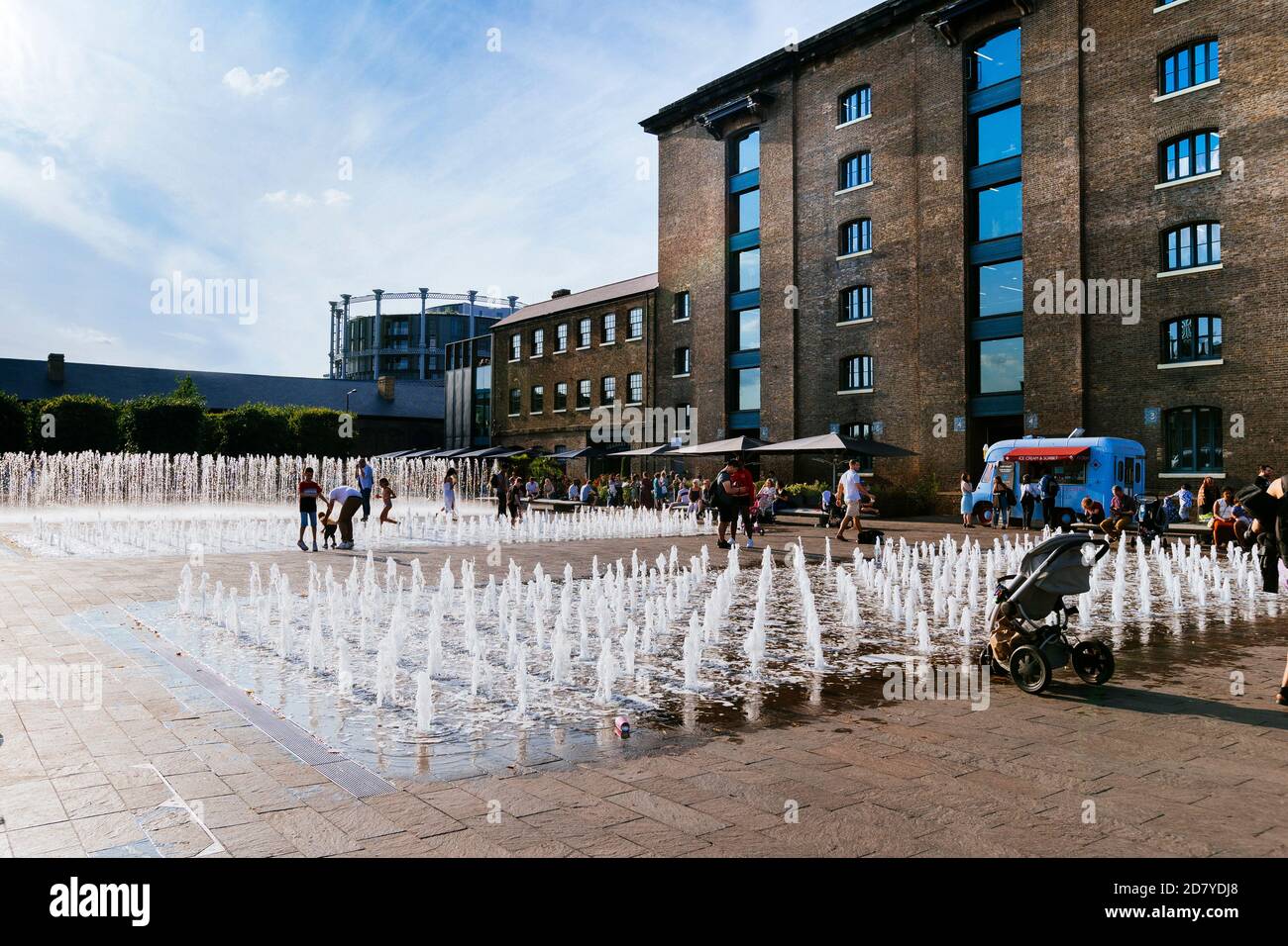 King's Cross London, UK, July 12, 2019: Granary Square People enjoy ...