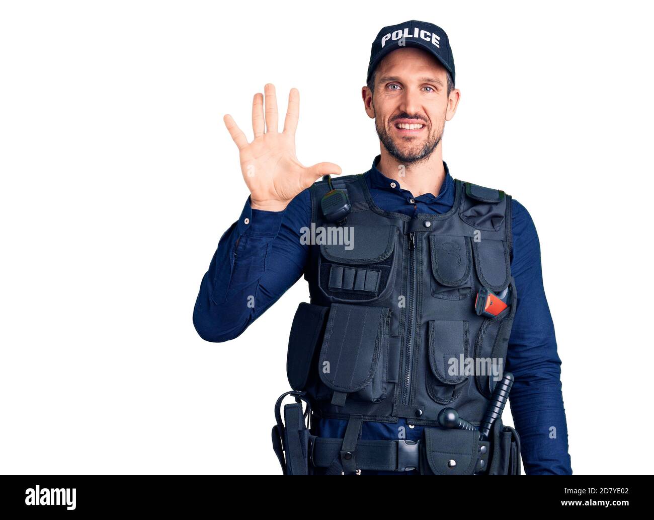 Young handsome man wearing police uniform showing and pointing up with ...