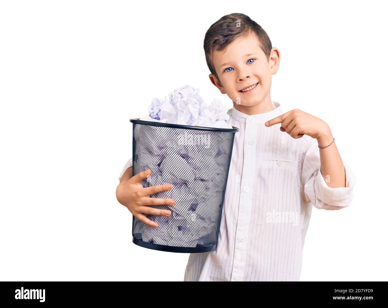 Cute blond kid holding paper bin full of crumpled papers smiling happy ...