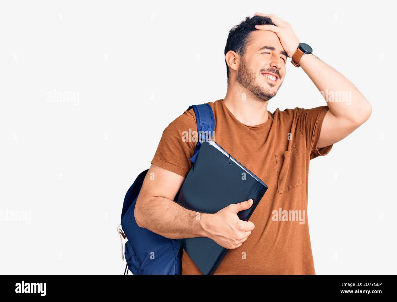 Young hispanic man wearing student backpack holding binder stressed and ...