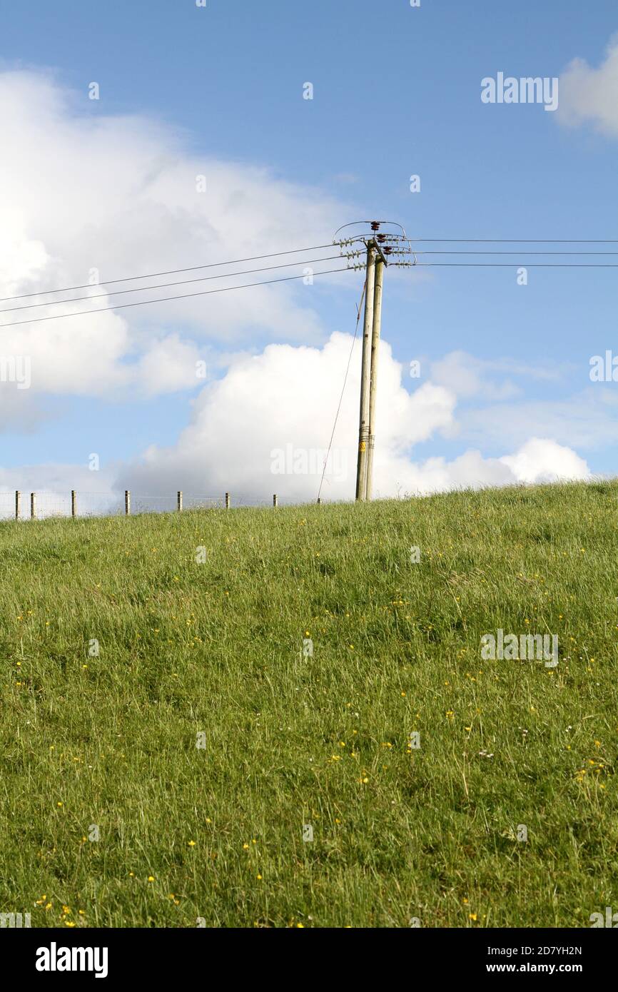 Overhead Electricity Powers lines in the Scottish Countryside, blue ...