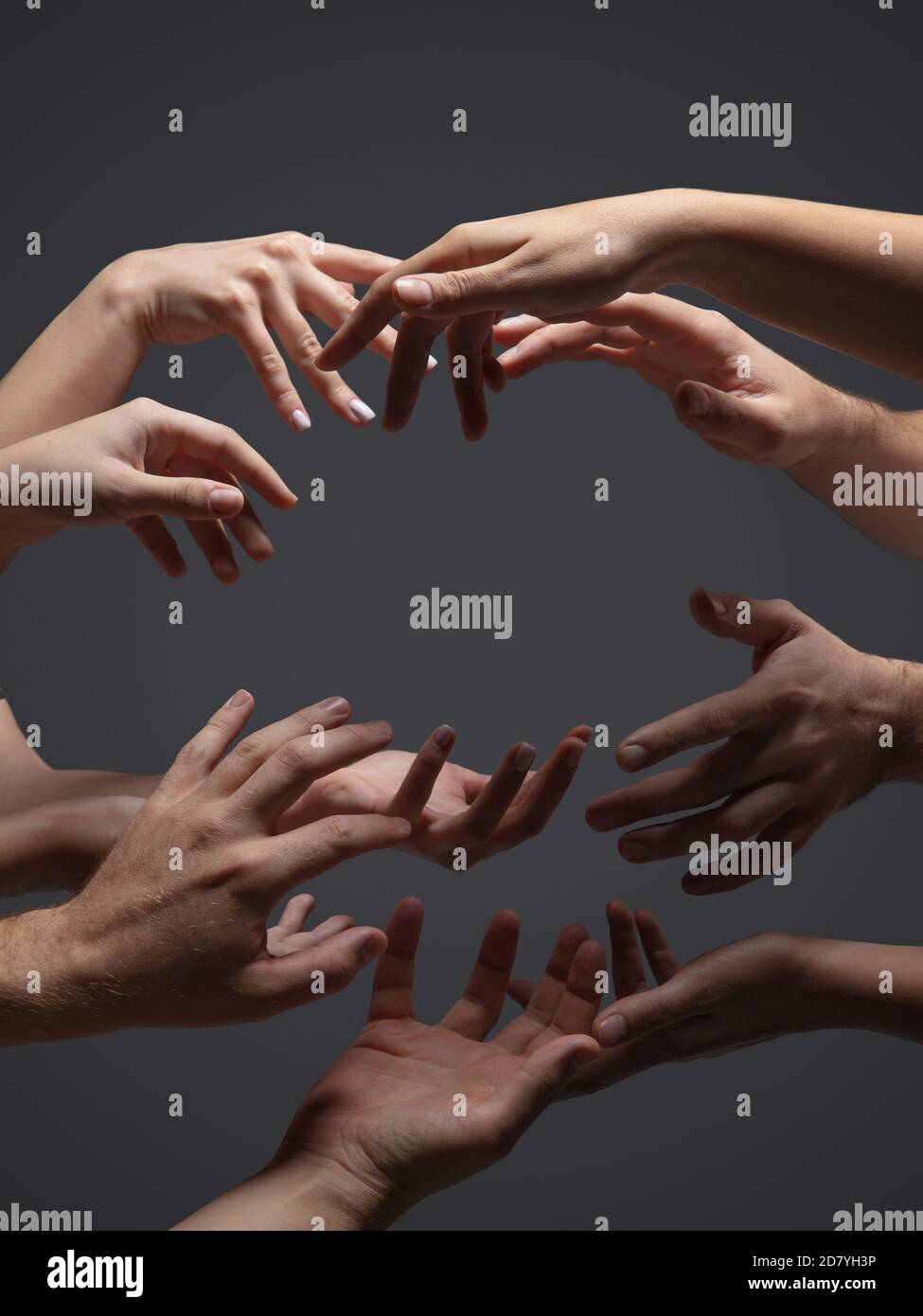 Hope. Hands of people's crows in touch isolated on grey studio ...