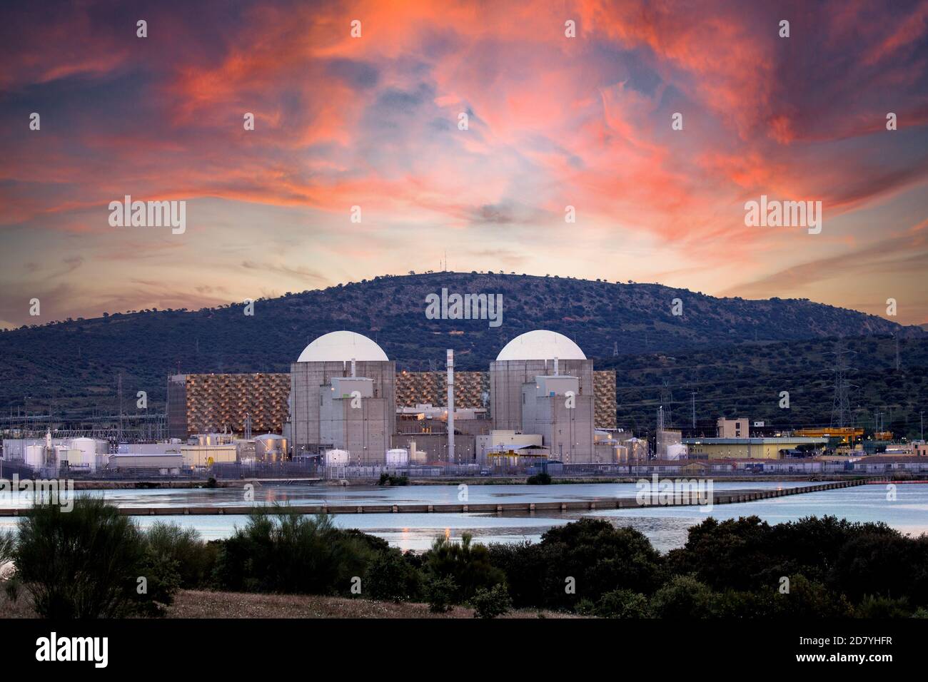 Spanish nuclear power plant next to a river with a stunning sky on the ...