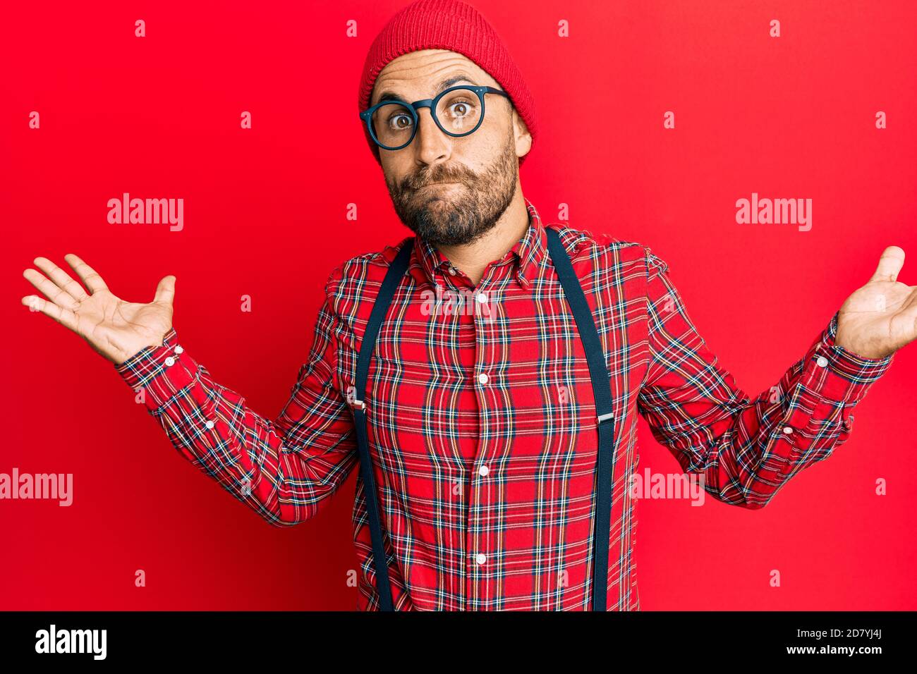 Handsome man with beard wearing hipster elegant look clueless and ...