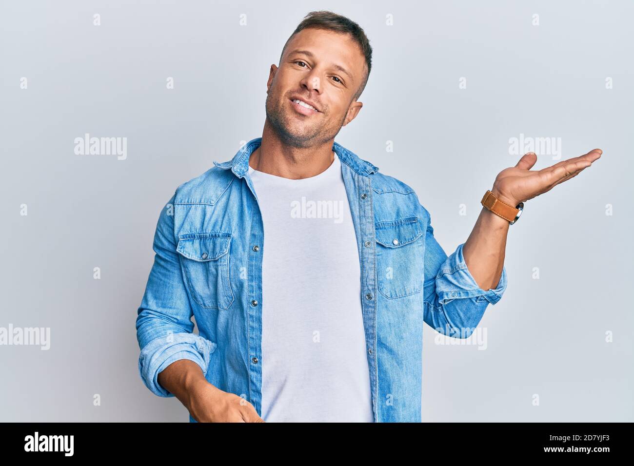 Handsome muscle man wearing casual denim jacket smiling cheerful ...