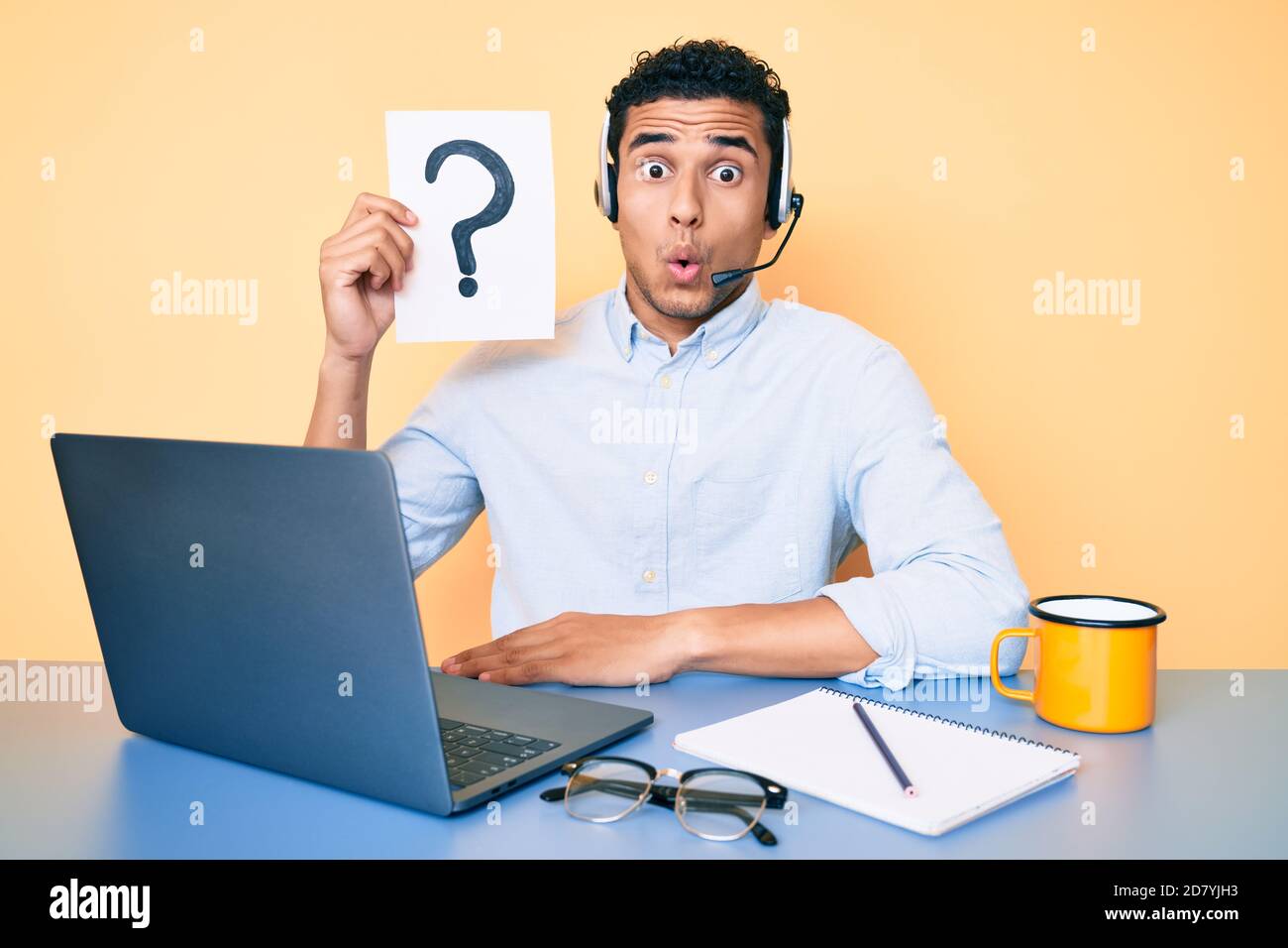Young handsome hispanic man holding question mark as customer support ...