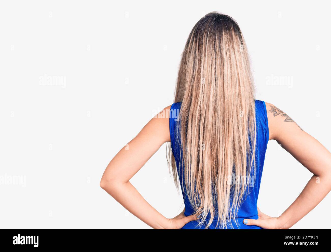 Young beautiful blonde woman wearing cheerleader uniform standing ...