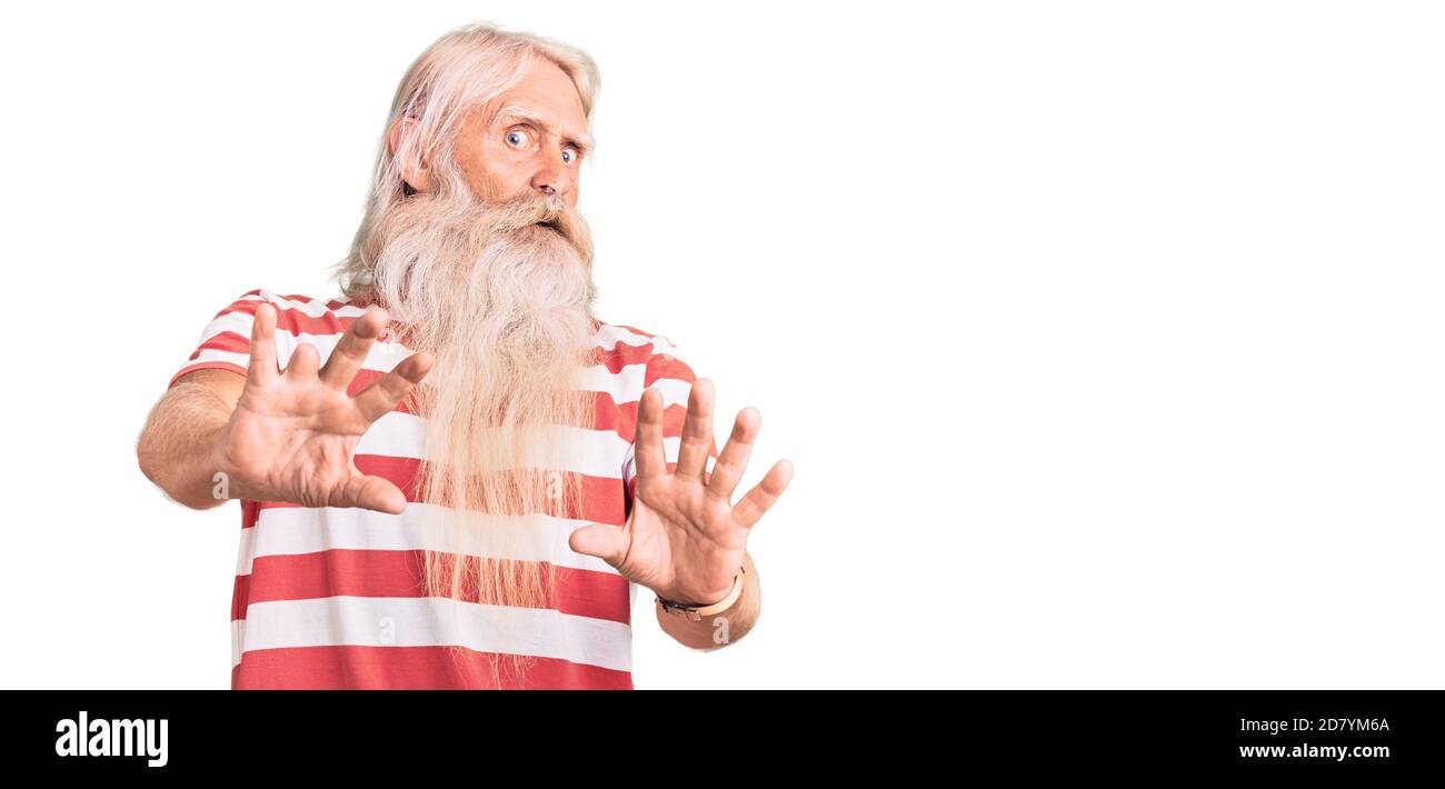 Old senior man with grey hair and long beard wearing striped tshirt ...