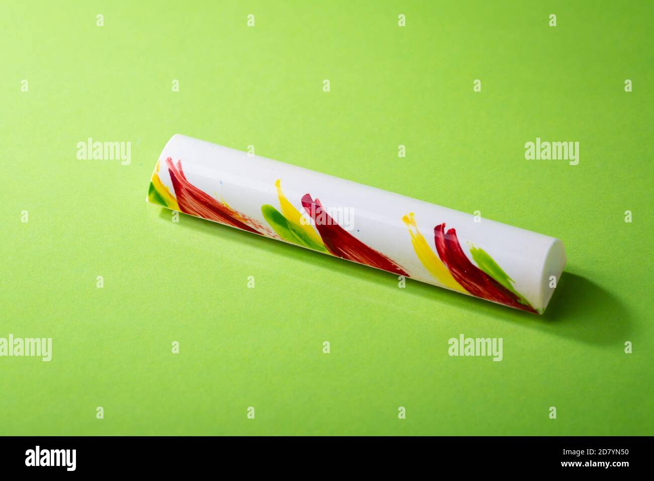 One candy on green surface Stock Photo - Alamy