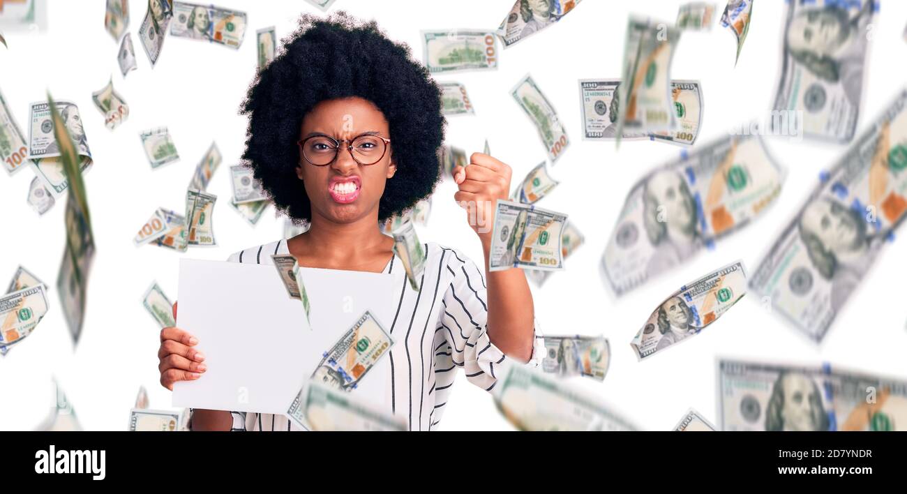 Young african american woman holding blank empty paper annoyed and ...