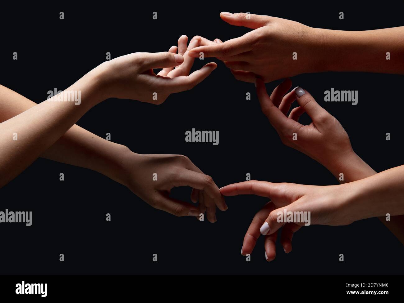Loving. Hands of people's crows in touch isolated on black studio ...