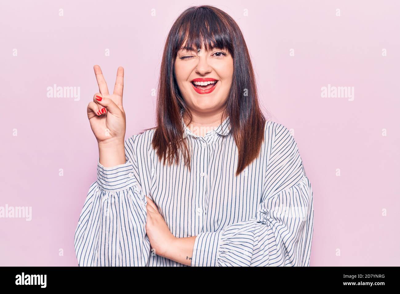 Young plus size woman wearing casual clothes smiling with happy face ...