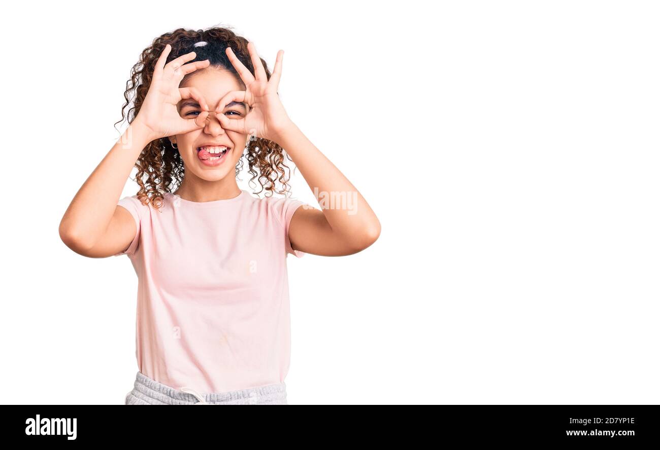 Beautiful kid girl with curly hair wearing casual clothes doing ok ...