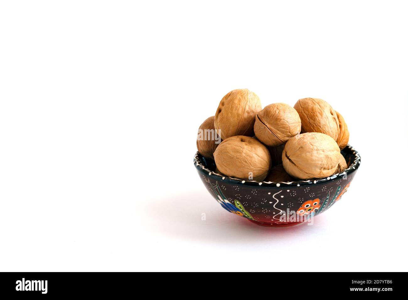 bowl with walnuts in shell on white background, copy space Stock Photo ...