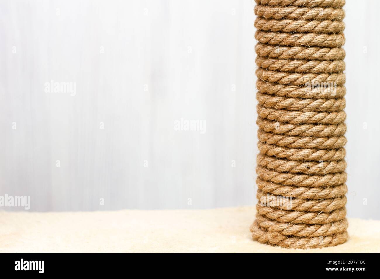 sisal rope cat scratching post on white background, copy space for text ...