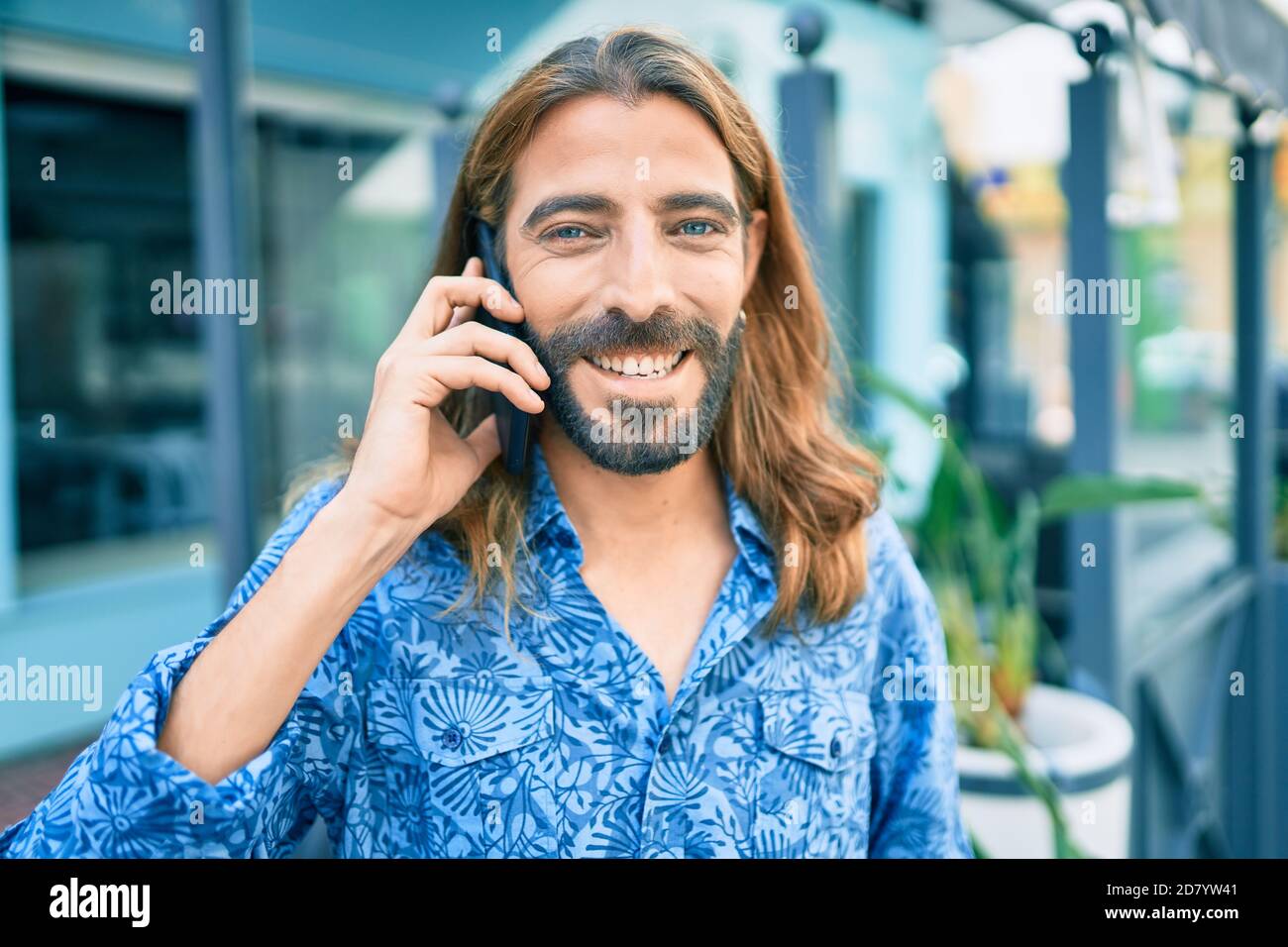 Young middle eastern man talking on the smartphone at the city Stock ...