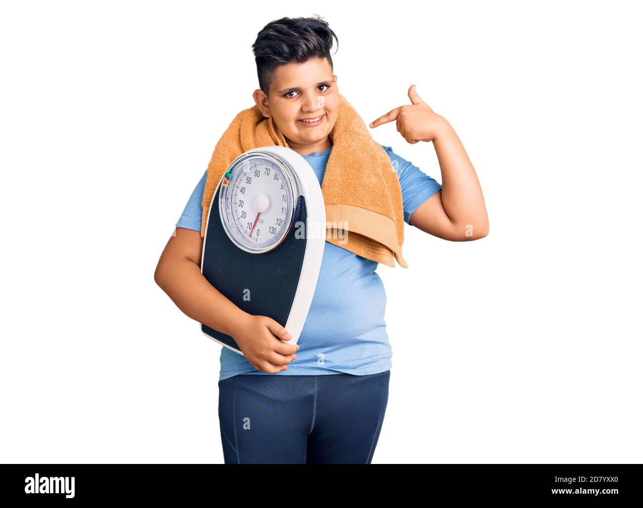 Little boy kid holding weight machine to balance weight loss pointing ...