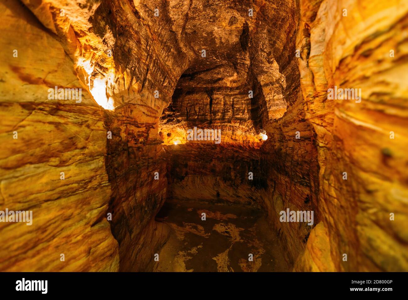 Ancient underground passage in sandstone at old underground temple ...