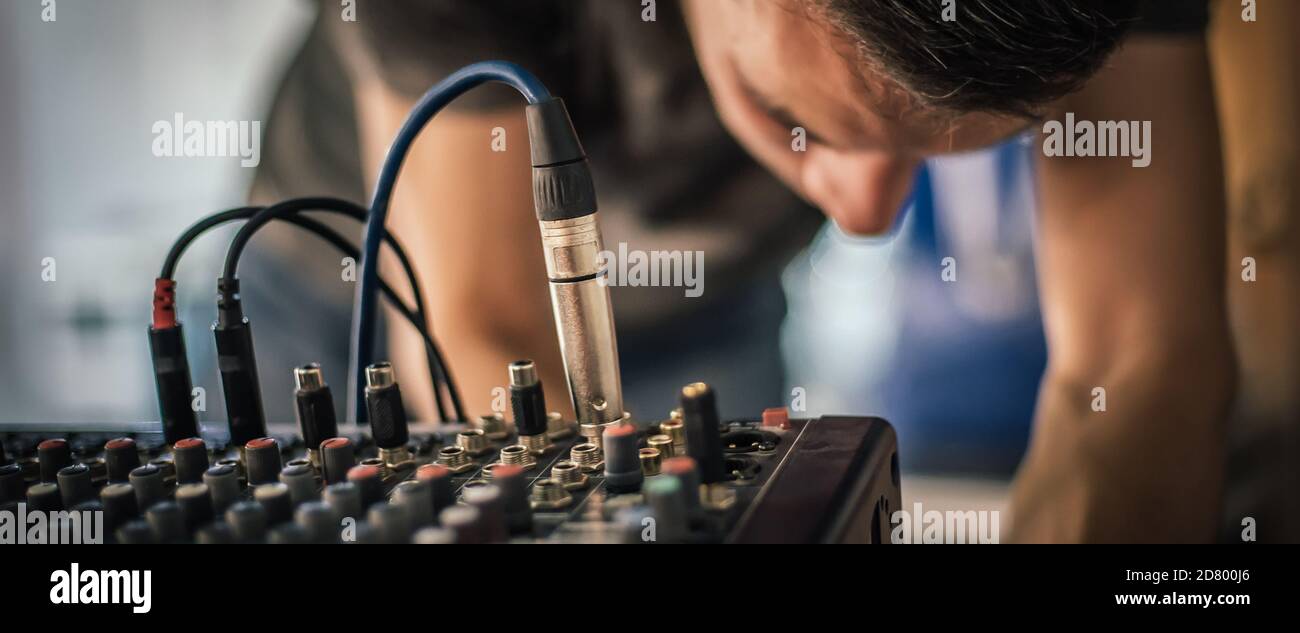 Behind the scene. Sound technician electric engineer adjusting sound ...