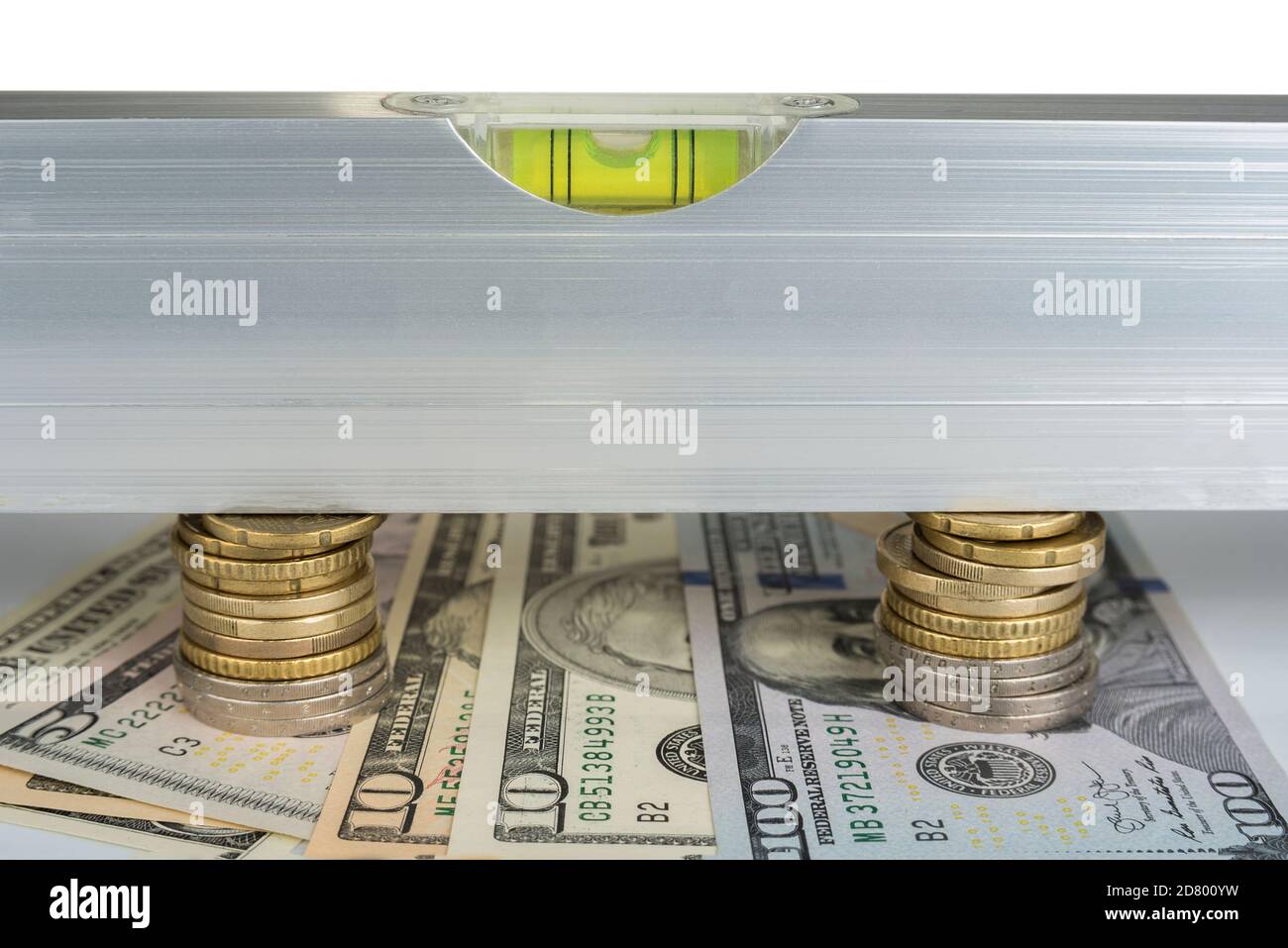 Paper money and coins with a level. Money balance concept Stock Photo ...