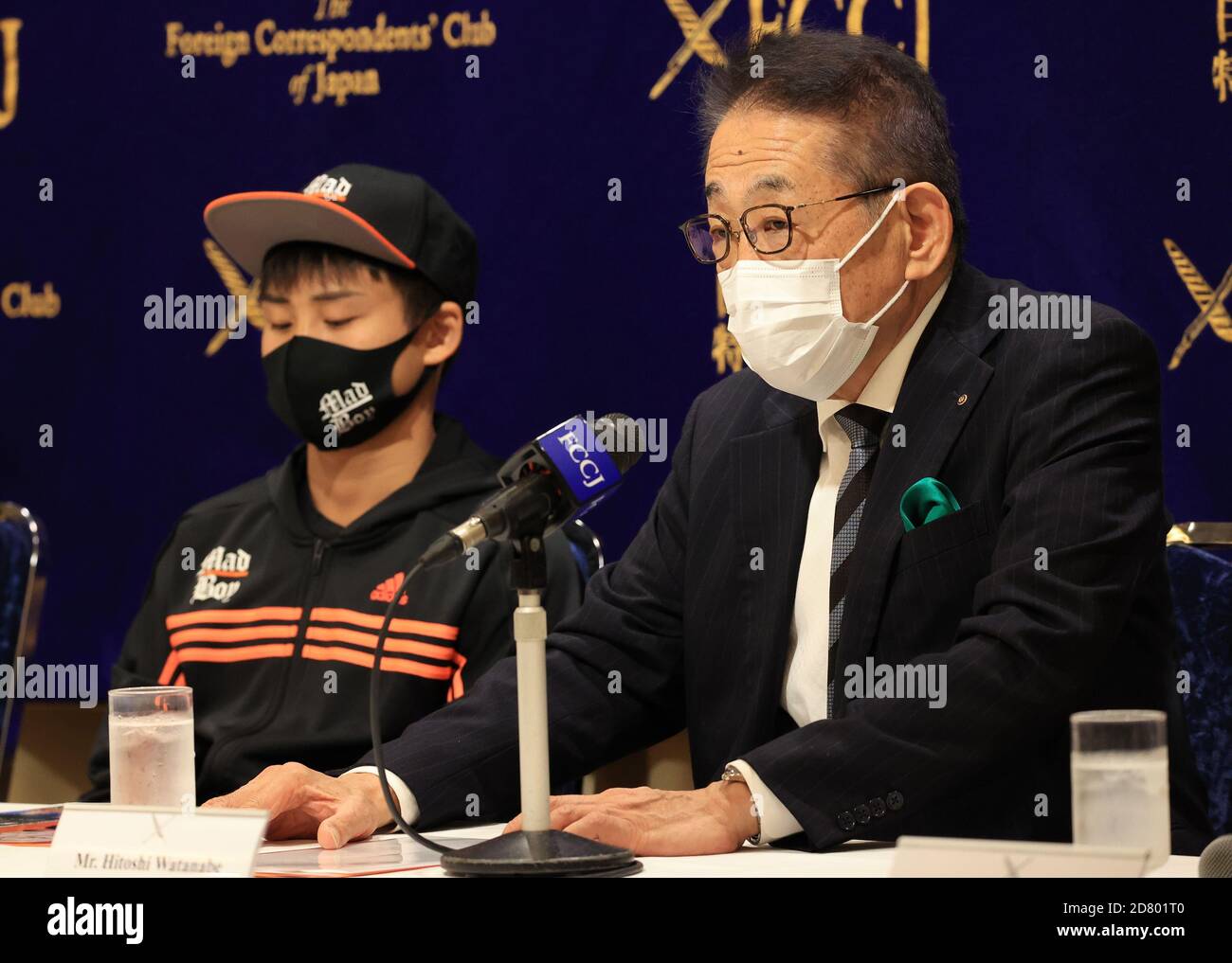 Tokyo, Japan. 26th Oct, 2020. Watanabe Promotion chairman Hitoshi Watanabe (R) speaks while WBA ...