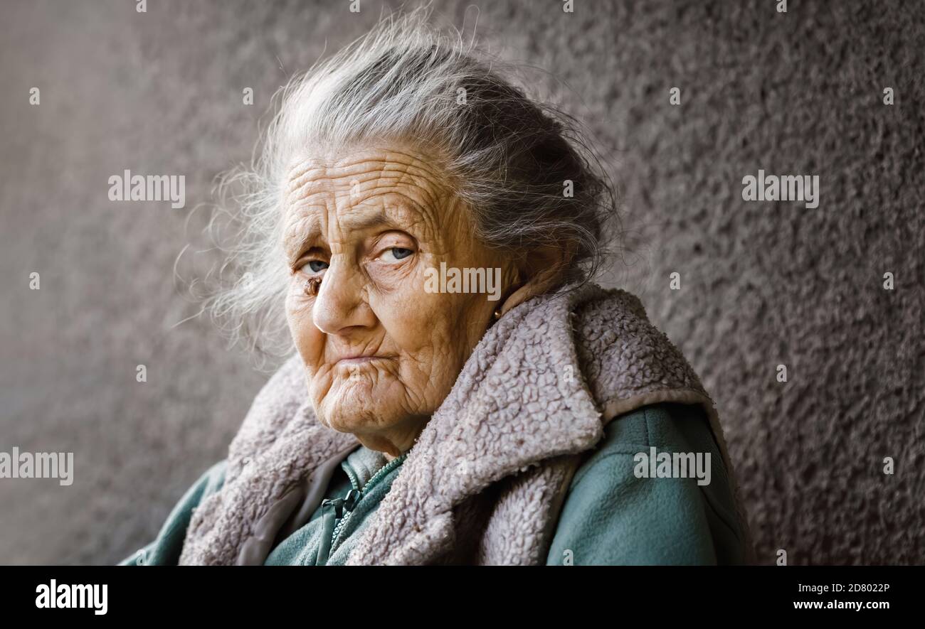 Old woman. Portrait of a very old and tired of life wrinkled woman ...