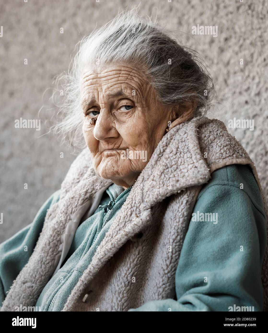 Old woman. Portrait of a very old and tired of life wrinkled woman ...