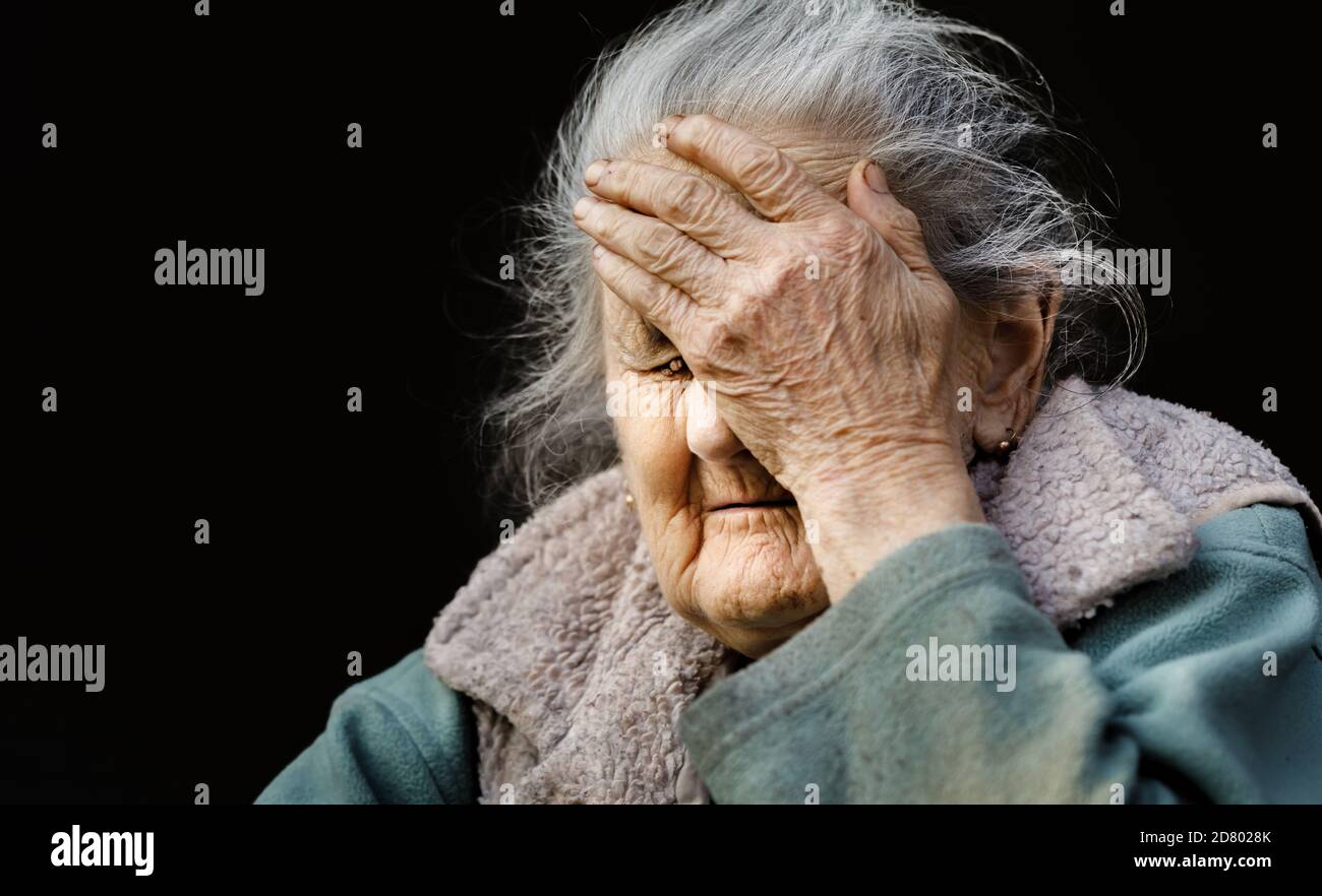 Old woman. Portrait of a very old and tired of life wrinkled woman ...