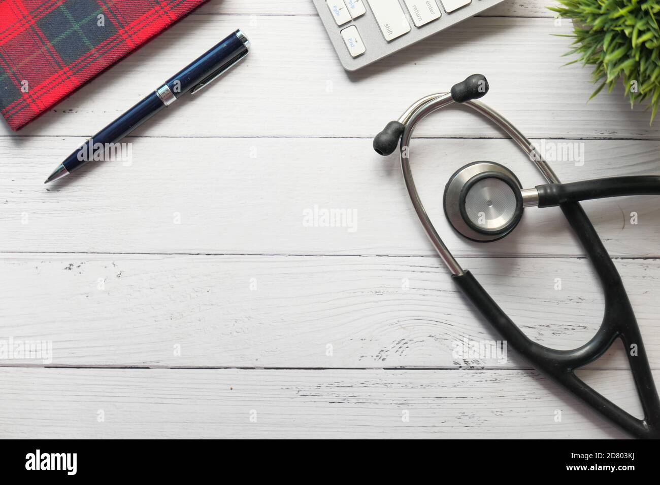 doctors workplace with container, keyboard and notepad on desk Stock ...