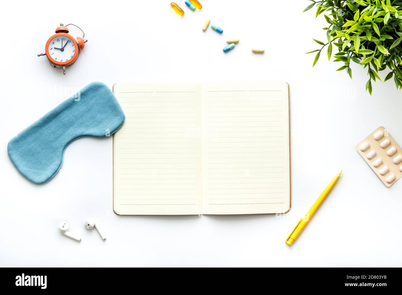 Keeping a diary and day plan on workplace before going to bed, top view ...