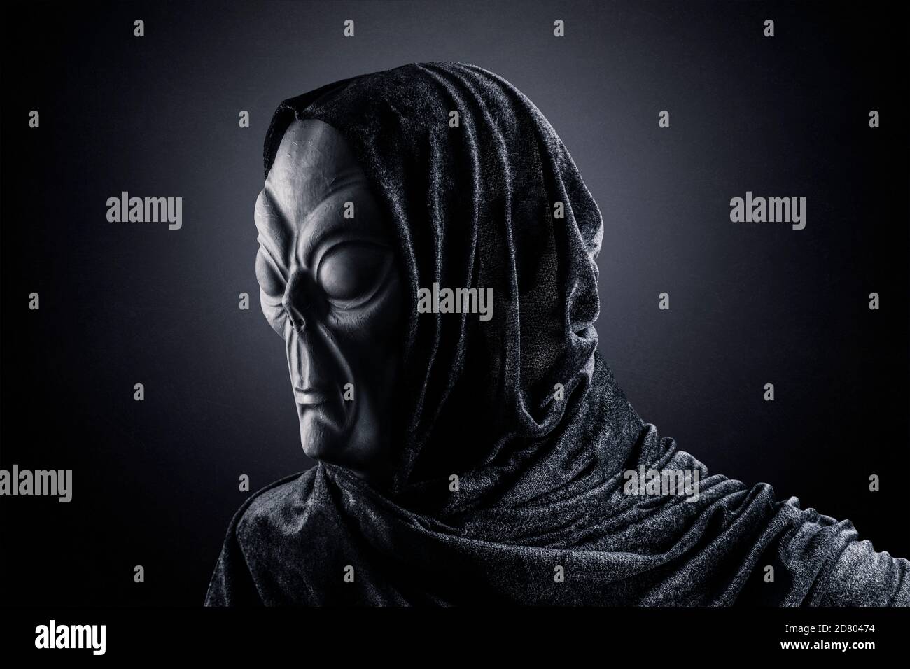 Portrait of a scary humanoid alien in the dark Stock Photo - Alamy