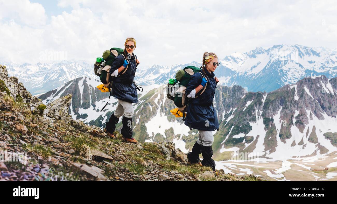 Girl Traveler hiking with backpack at rocky mountain landscape Travel ...