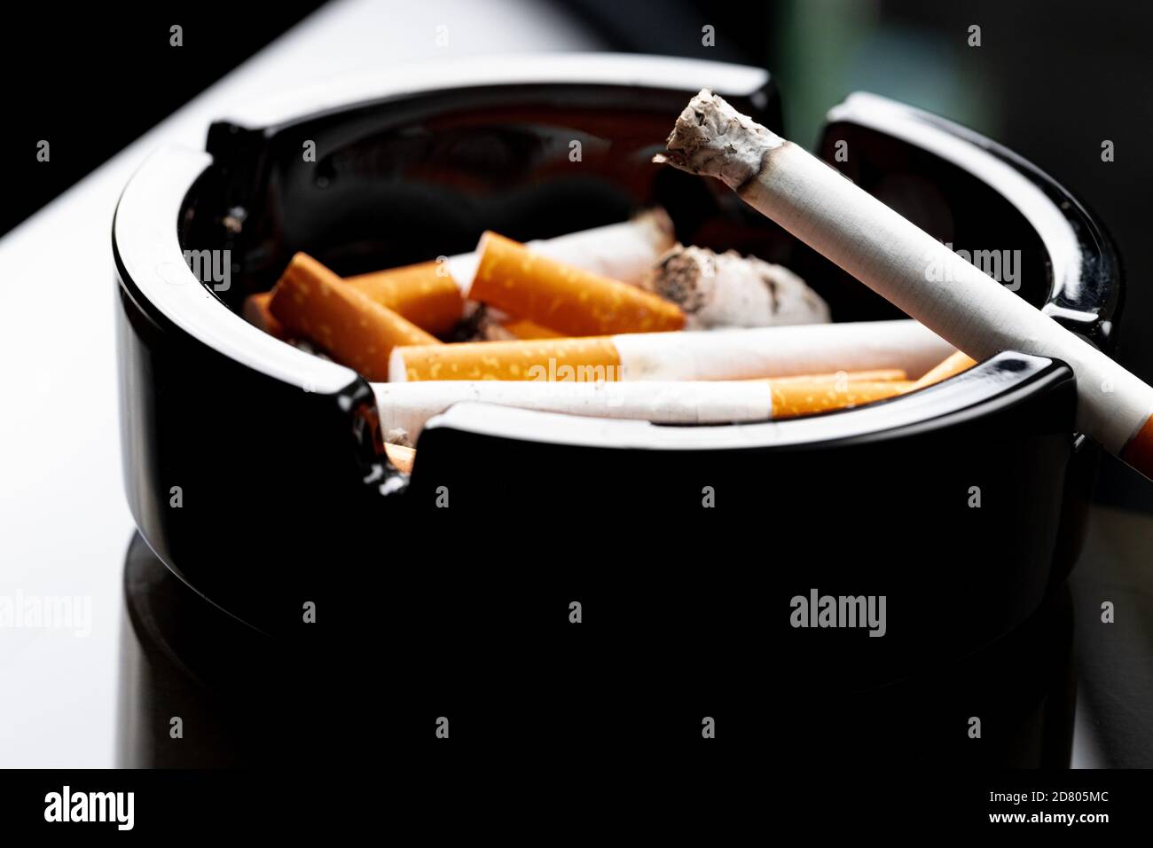 Burning cigarette in an ashtray hi-res stock photography and images - Alamy