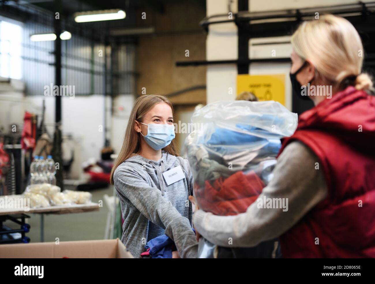 Woman charity clothes bag hi-res stock photography and images - Alamy