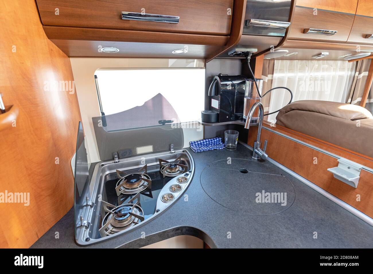 Gas Burner Stove and Kitchen Counter in Camper Van Stock Photo - Alamy