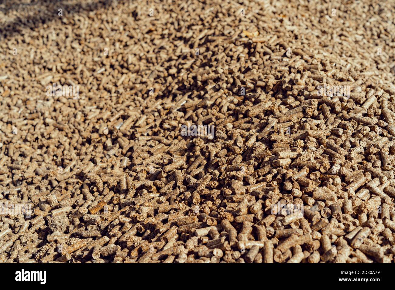 Large pile of compressed eco wood pellets Stock Photo - Alamy