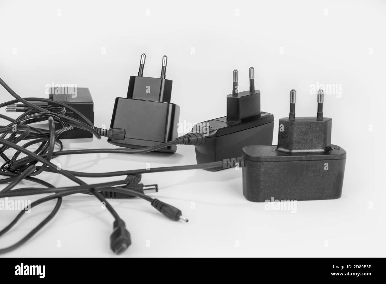 Mobile phone chargers on a white background Stock Photo - Alamy