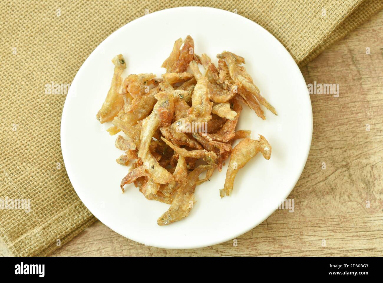 crispy fried anchovy fish with salt on plate Stock Photo - Alamy