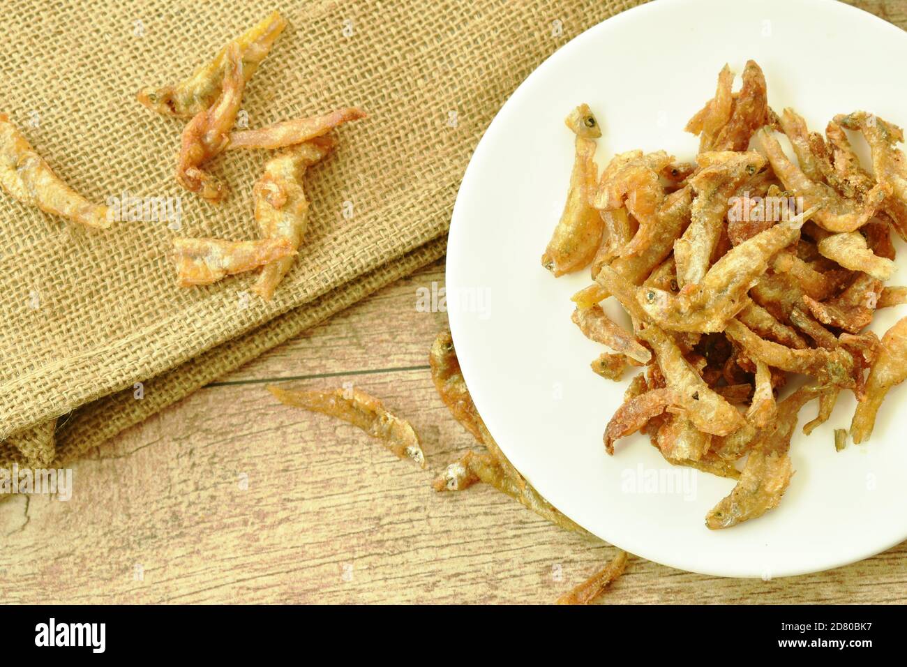 crispy fried anchovy fish with salt on plate Stock Photo - Alamy