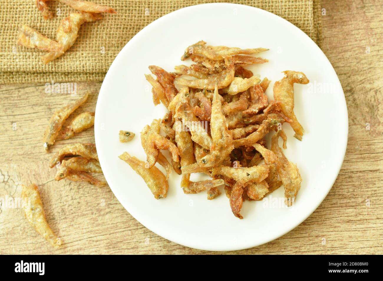 crispy fried anchovy fish with salt on plate Stock Photo - Alamy