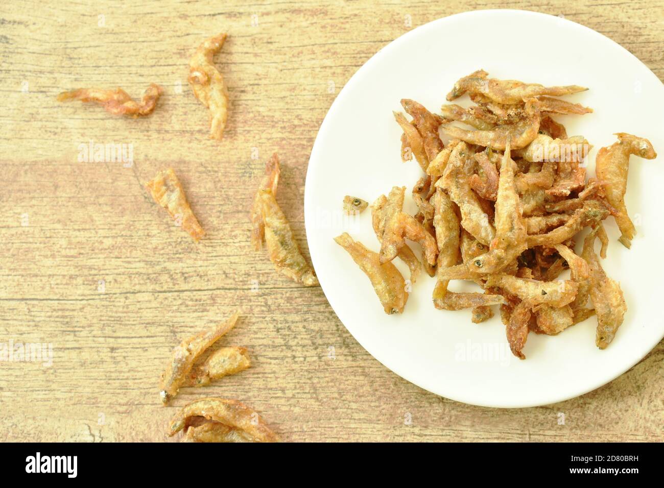 crispy fried anchovy fish with salt on plate Stock Photo - Alamy