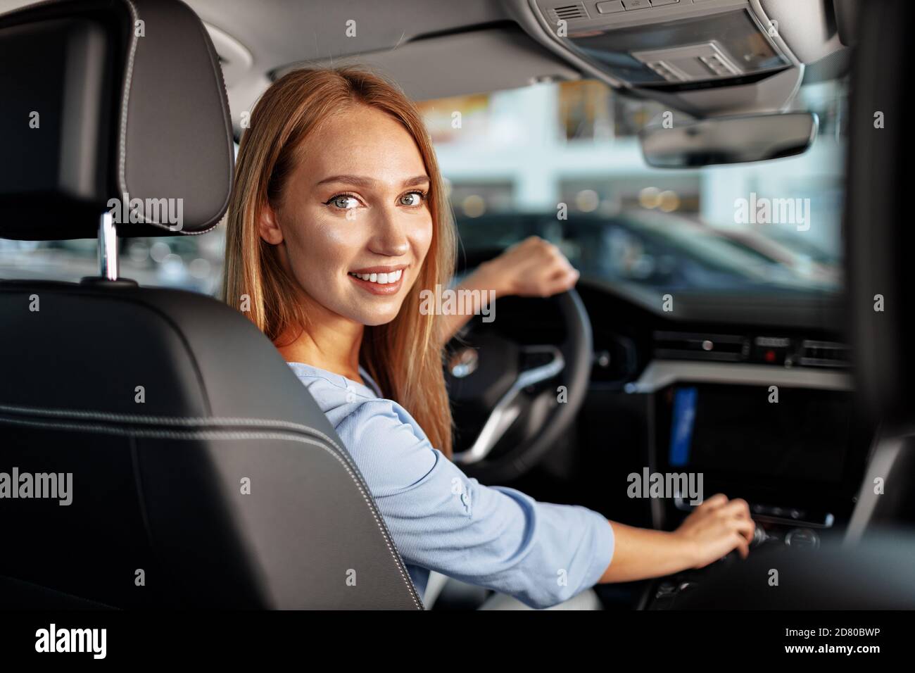 Happy woman new car owner sitting in driver seat Stock Photo - Alamy