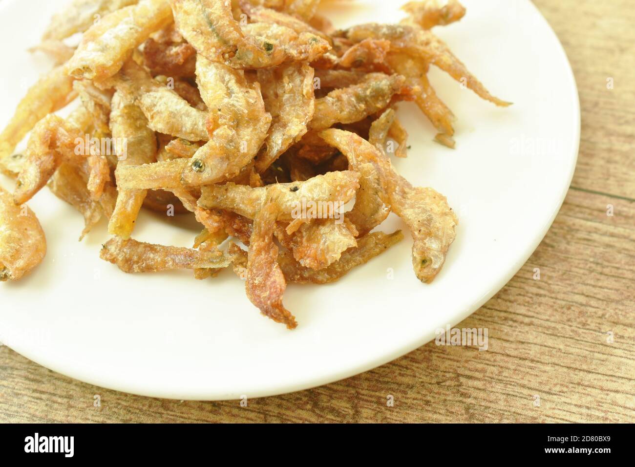 crispy fried anchovy fish with salt on plate Stock Photo - Alamy