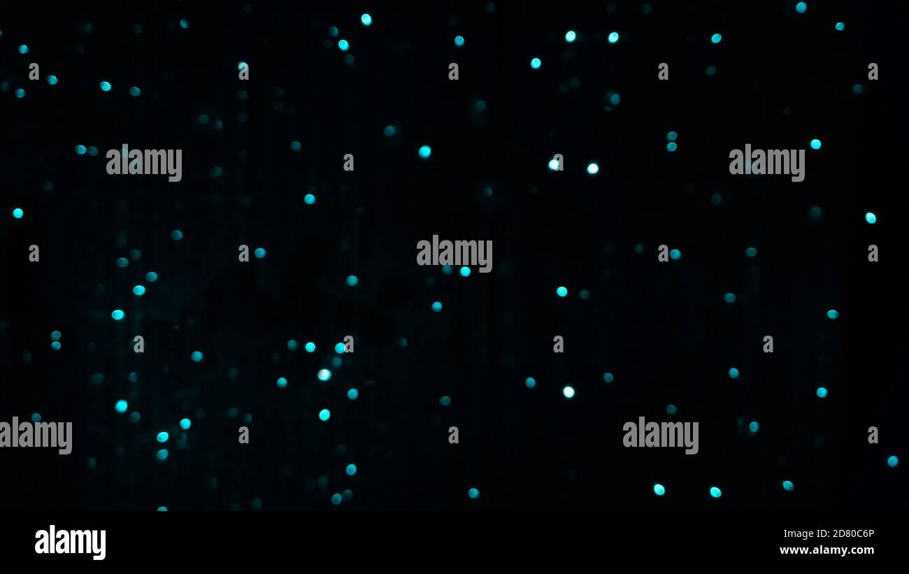 Blue blurred background of LED flashing, blinking and flickering bulbs ...