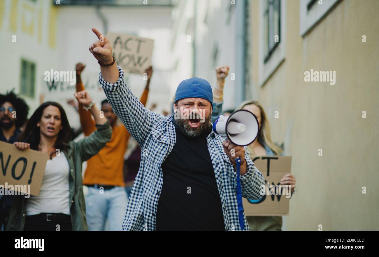 Group of people activists protesting on streets, strike and ...