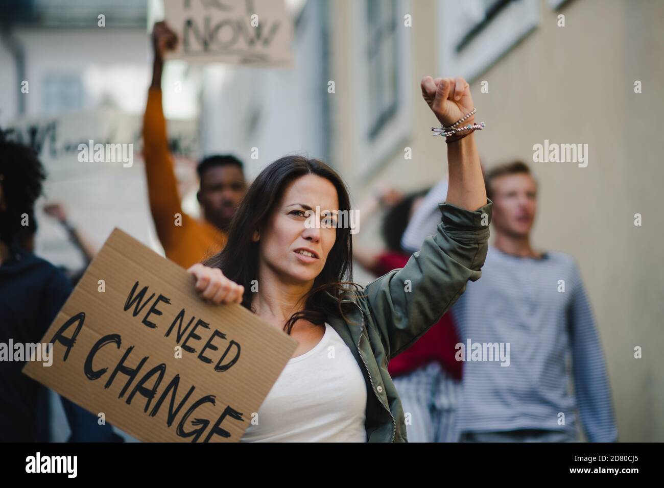 Group of people activists protesting on streets, strike and ...